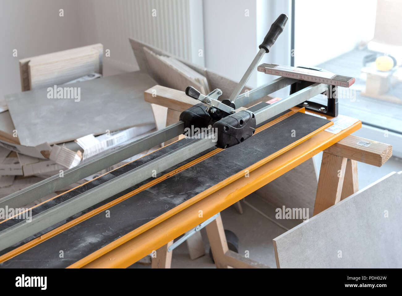 Cutter machine for ceramic tiles. A flat during renovation Stock Photo ...