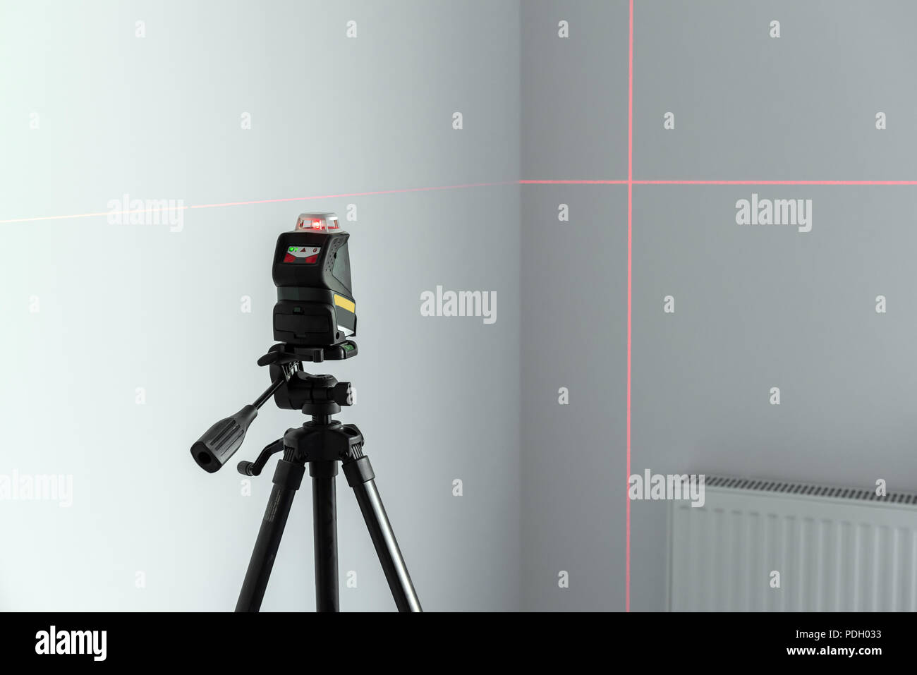 Laser spirit level during finishing works in flat Stock Photo - Alamy
