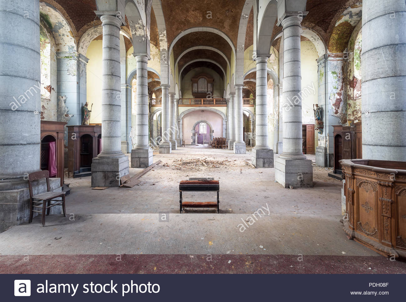 Decaying interior of an abandoned building with peeling paint and ...