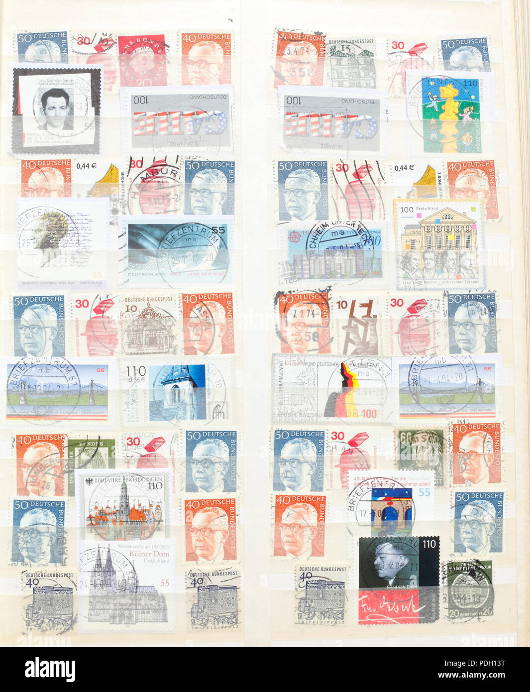 colorful old German stamped stamps in a stamp album Stock Photo - Alamy