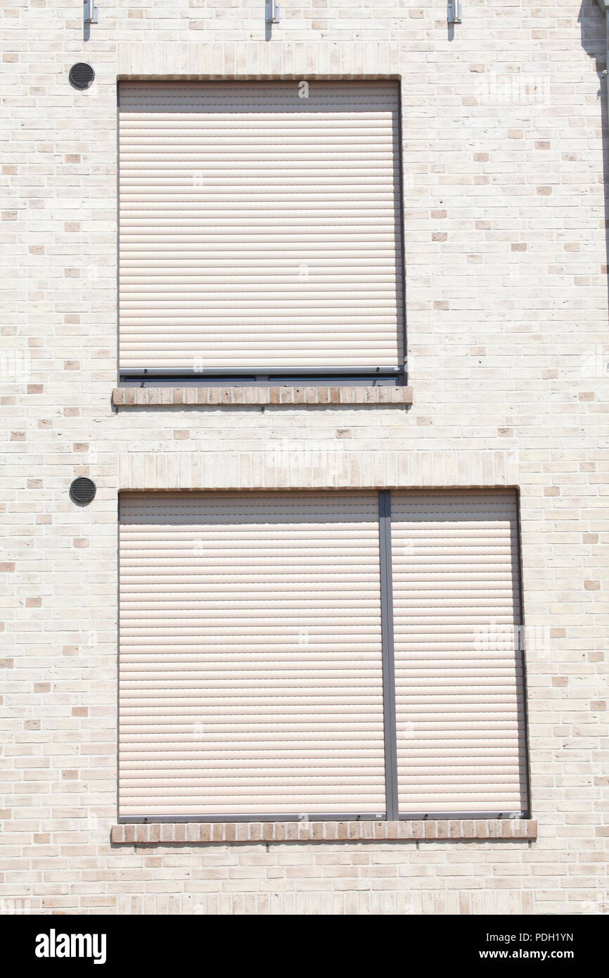 white windows with blinds pulled down Stock Photo - Alamy