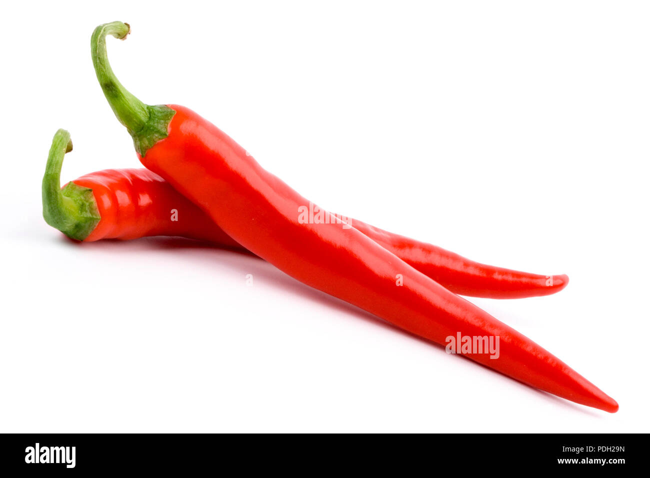two red chilly peppers isolated on white background Stock Photo - Alamy