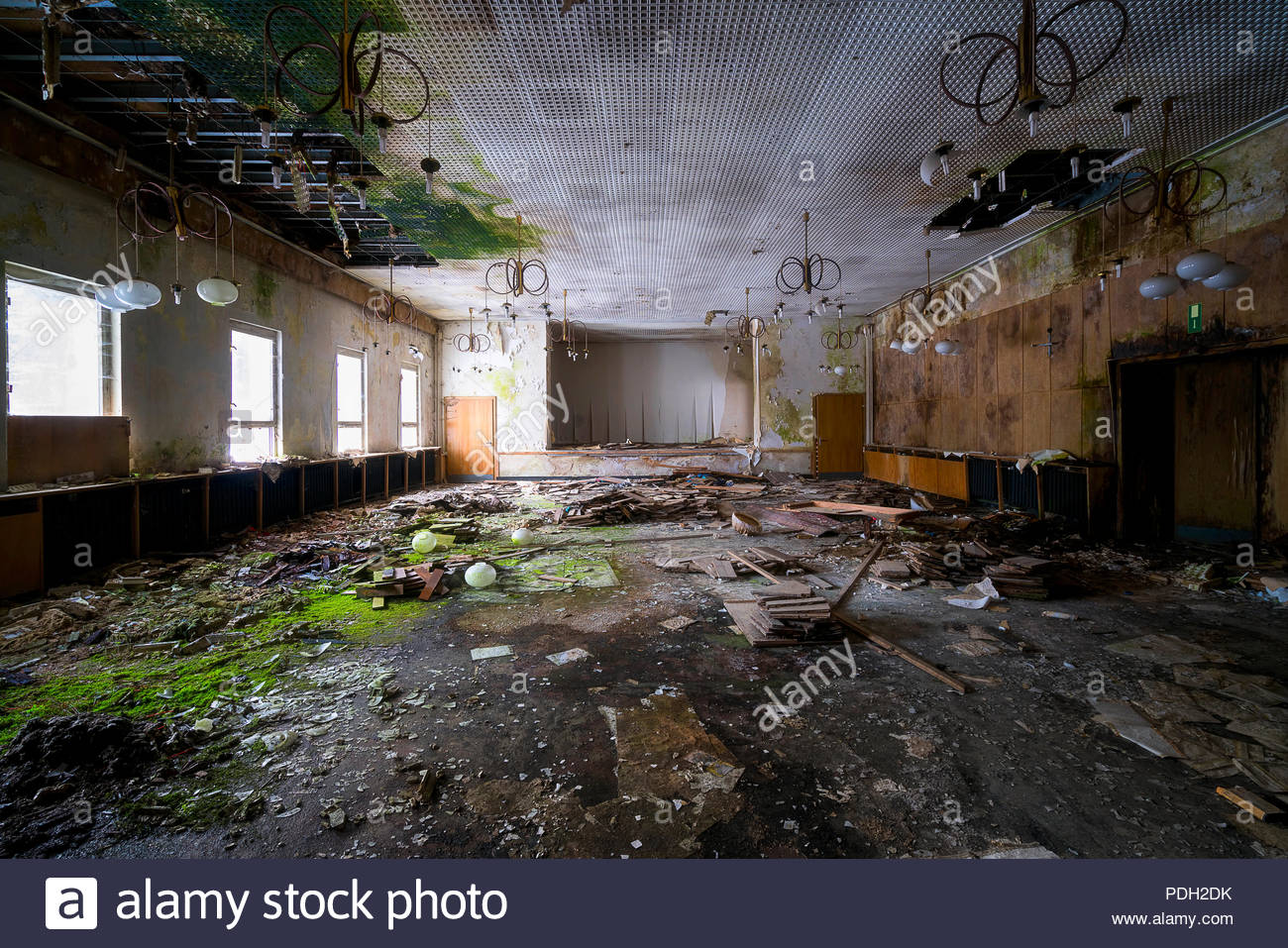 Decaying interior of an abandoned building with peeling paint and ...