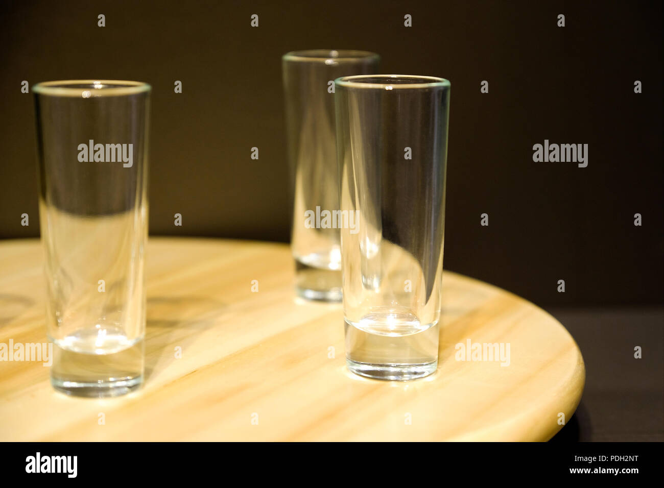 Lots of empty glasses. Against the rack Stock Photo - Alamy