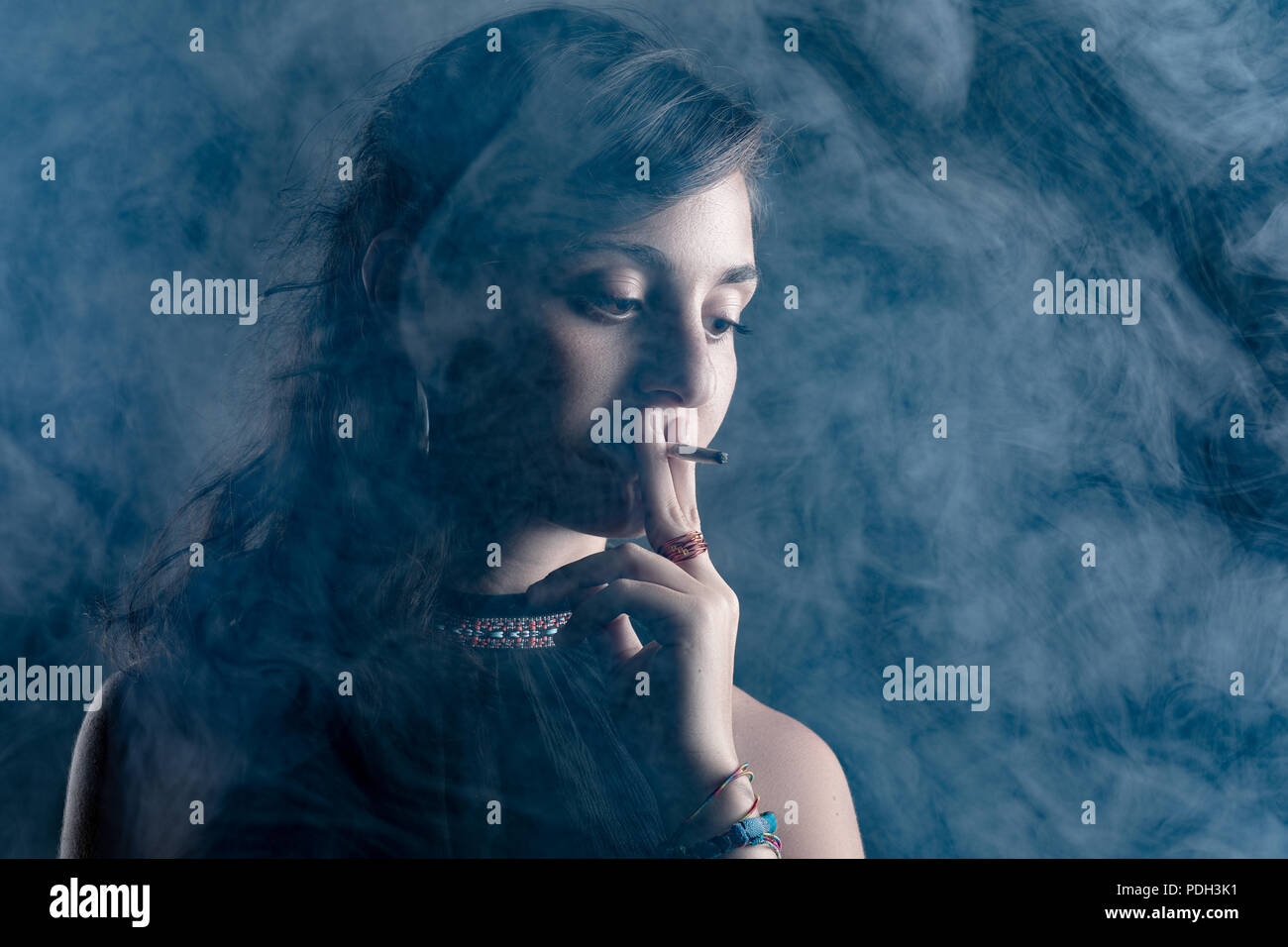 Woman smoking a joint hi-res stock photography and images - Alamy