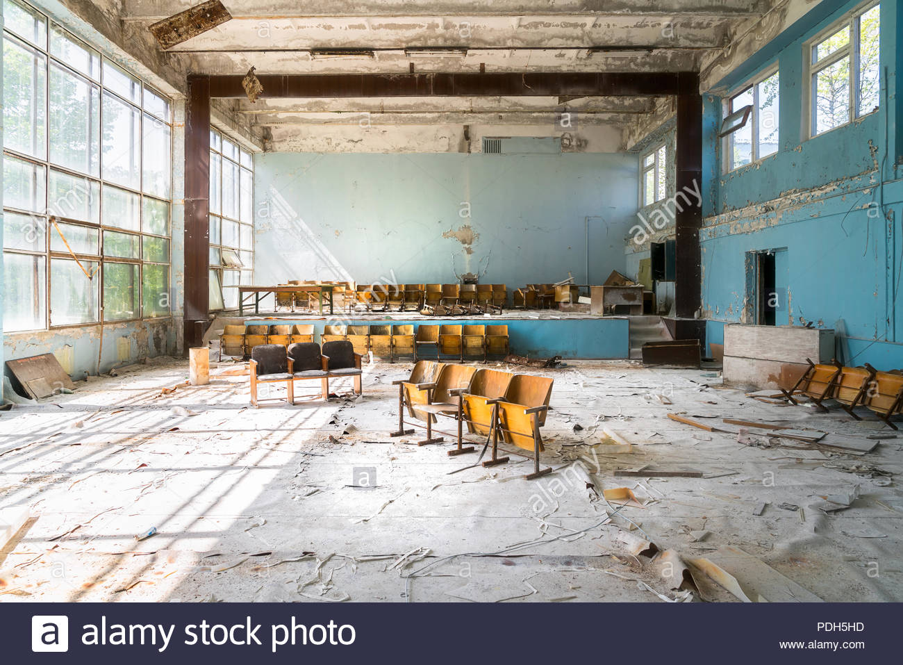 Decaying interior of an abandoned building with peeling paint and ...
