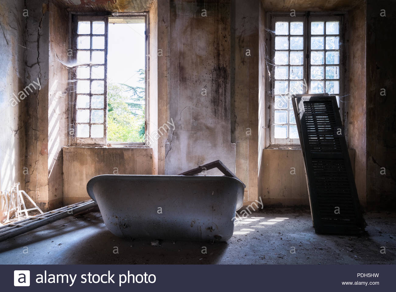 Decaying interior of an abandoned building with peeling paint and ...