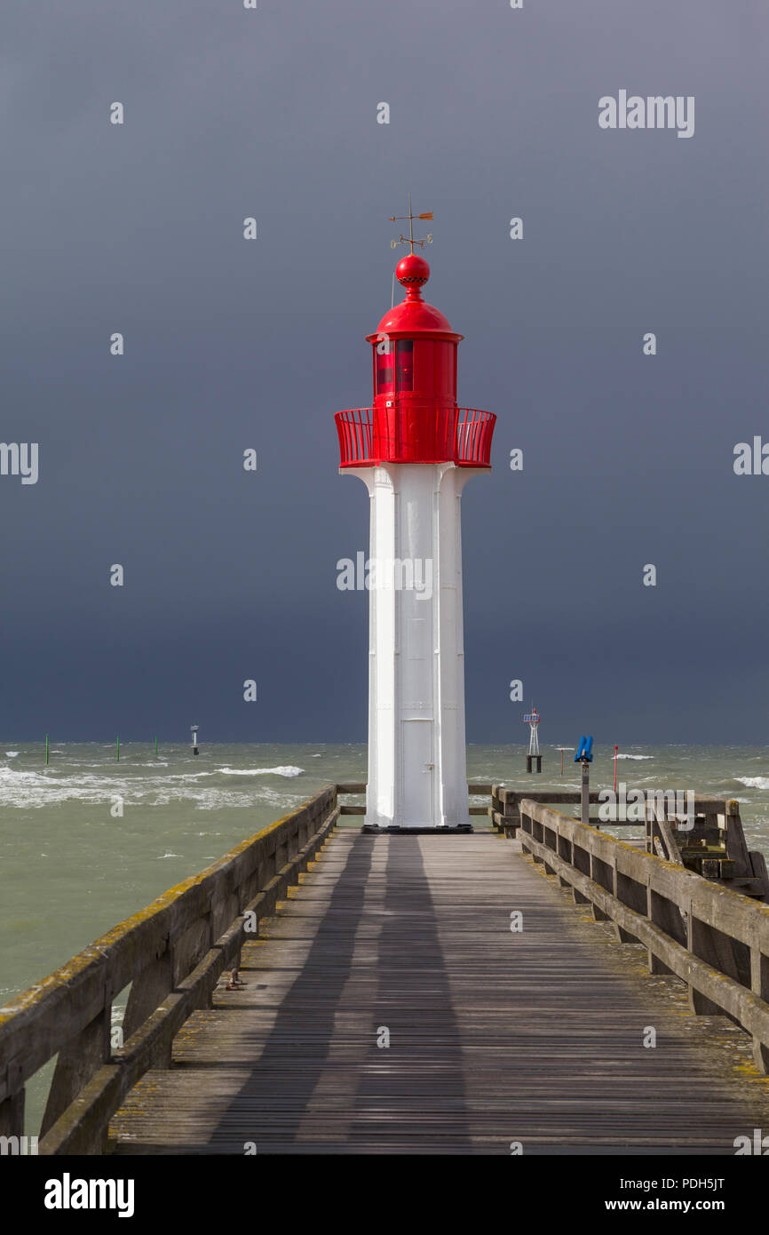 The red painted East lighthouse protecting the harbour at Trouville-sur ...
