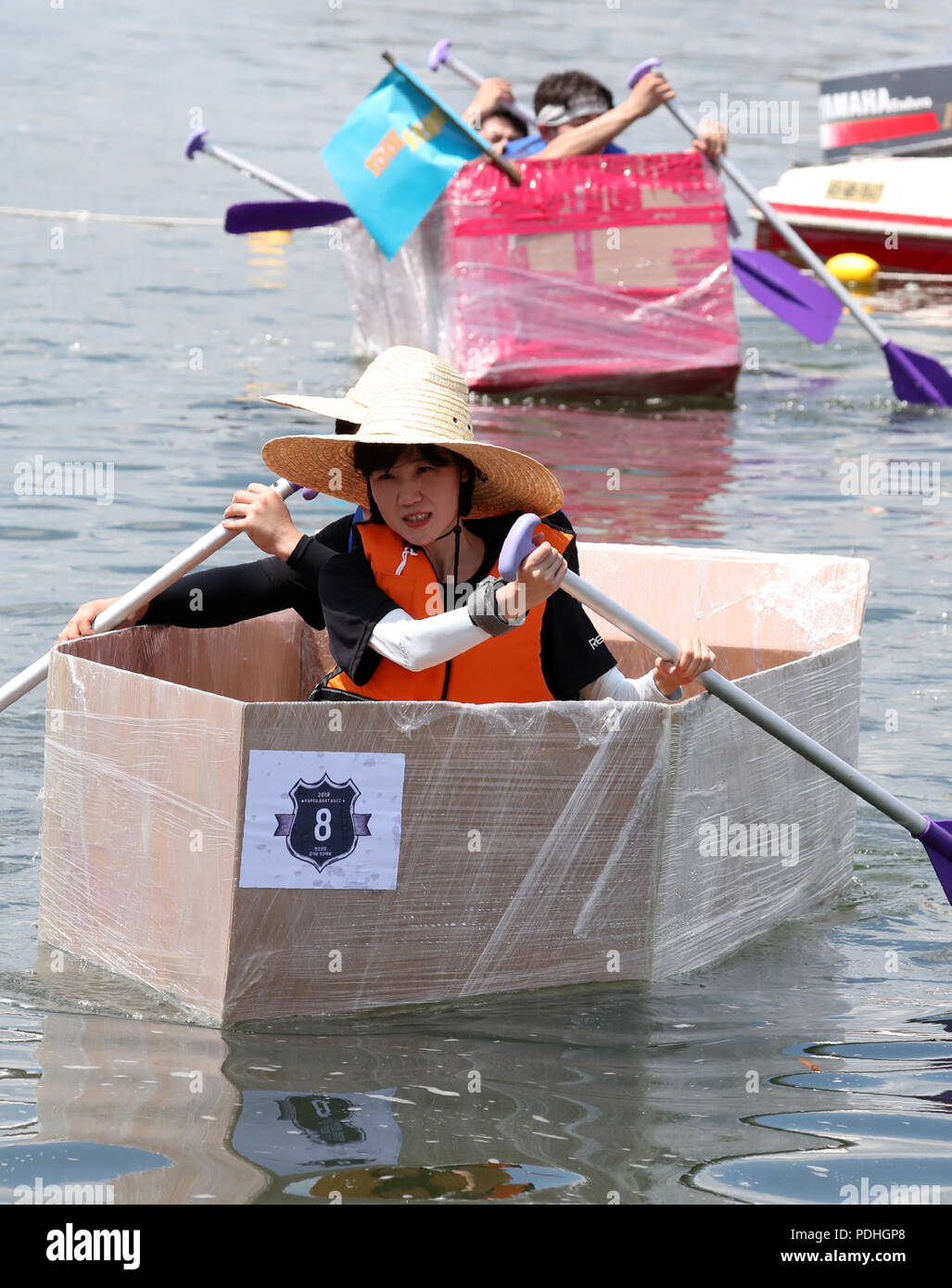 10th Aug, 2018. Paper boat People cross the Han River during an event ...