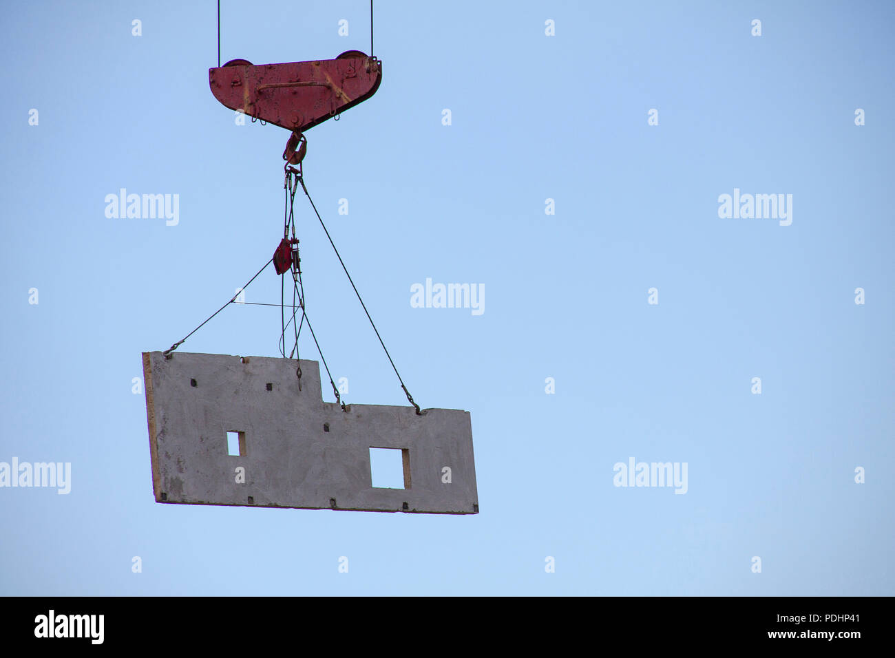 Hoisting construction works with tower crane during erection multistory ...