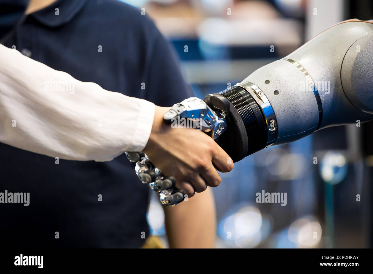 Robot hand shaking human hand. Concept picture of robot and man ...