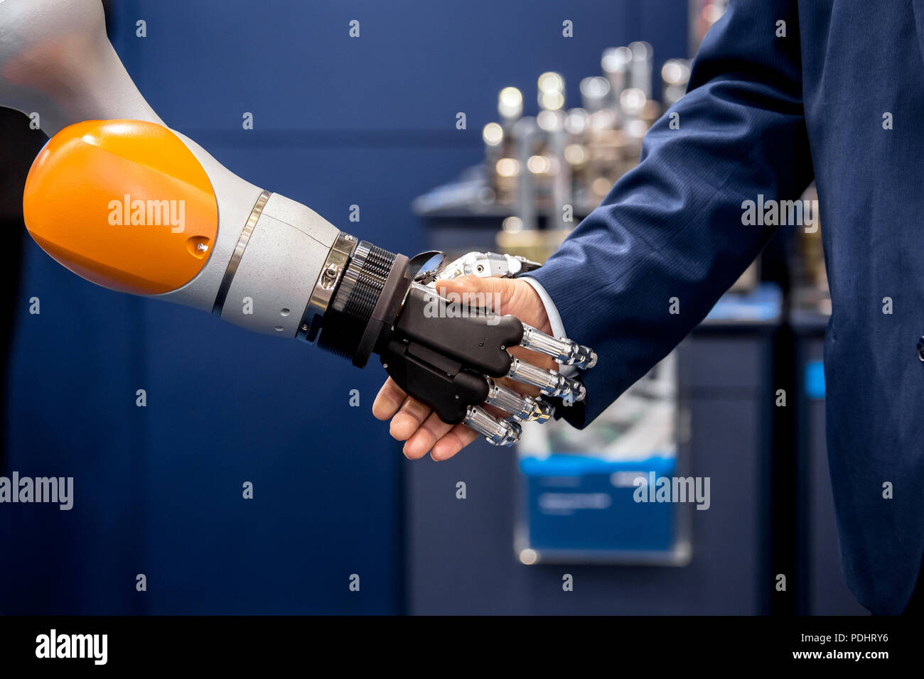Robot hand shaking human hand. Concept picture of robot and man ...