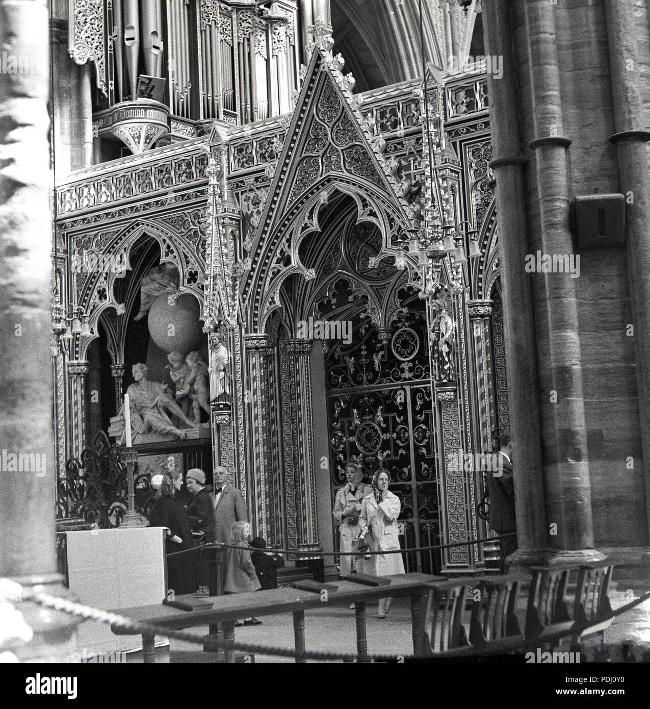 1960s, visitors inside Westminster Abbey, an ancient royal church in ...
