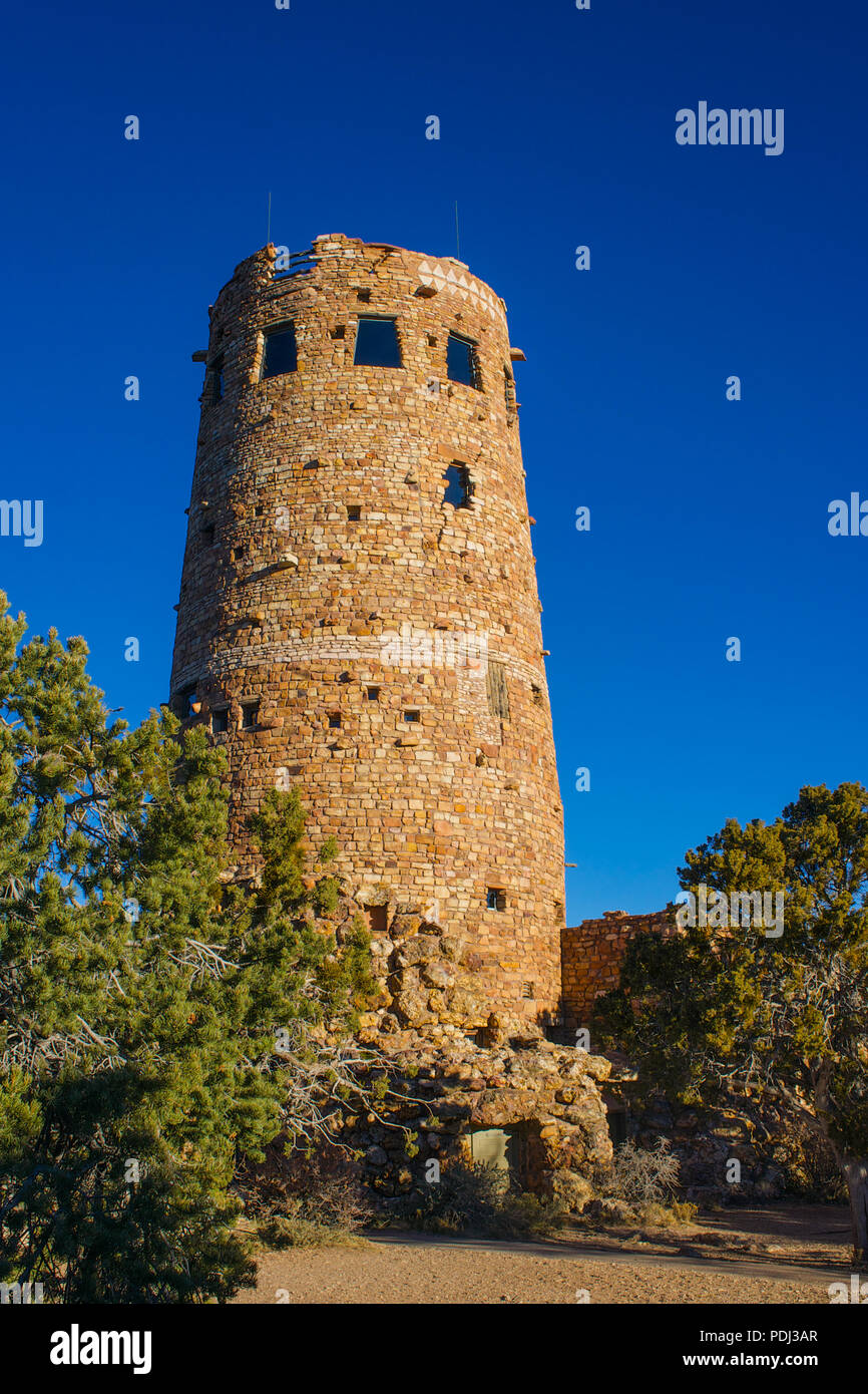 Sun shines off the walls of stone in the Desert Watchtower overlooking ...
