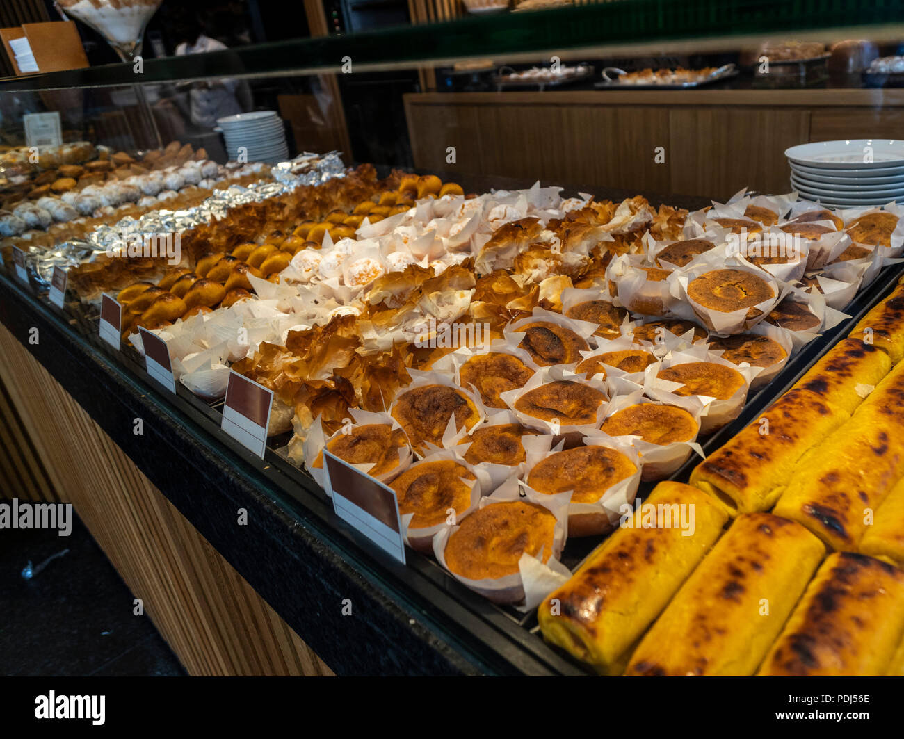 Typical portuguese pastry inside a bakery display Stock Photo - Alamy