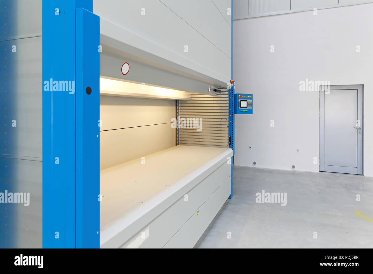 High density carousel storage in distribution warehouse Stock Photo - Alamy
