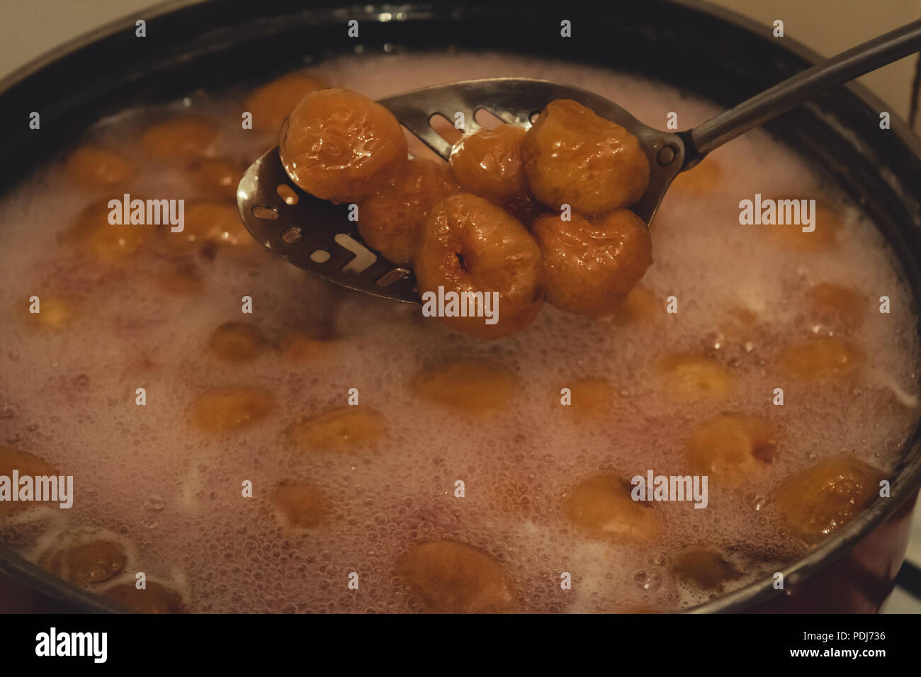 Making of homemade fig jam. Boiled figs in a spoon Stock Photo - Alamy