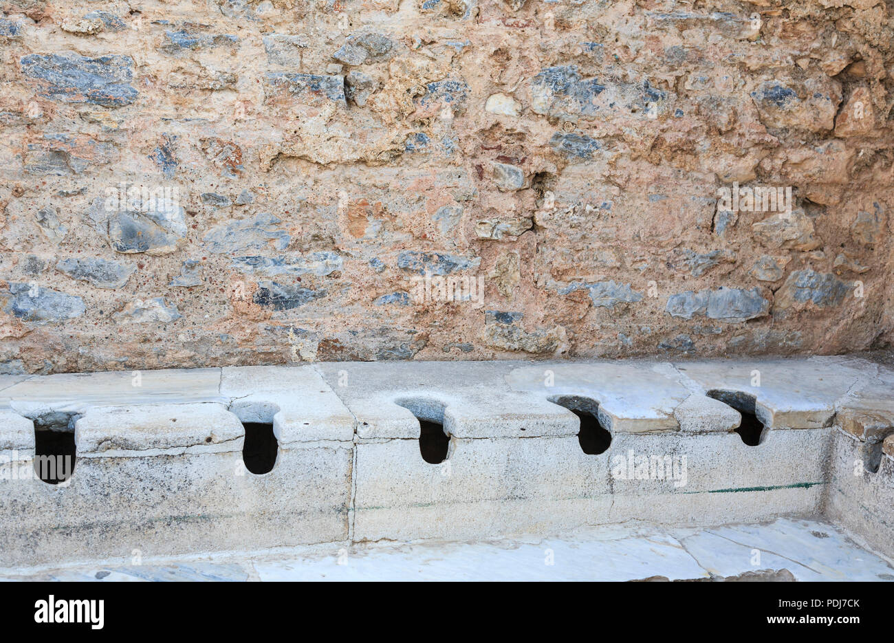 Stone communal toilets at Ephesus, an ancient Greek city settlement ...