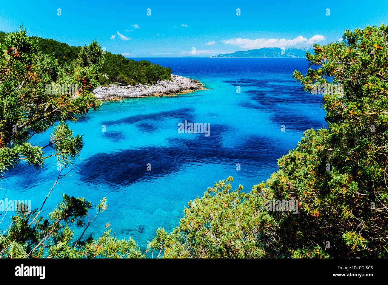 Azure hidden bay on greek island. Crystal clear water on sunny ...