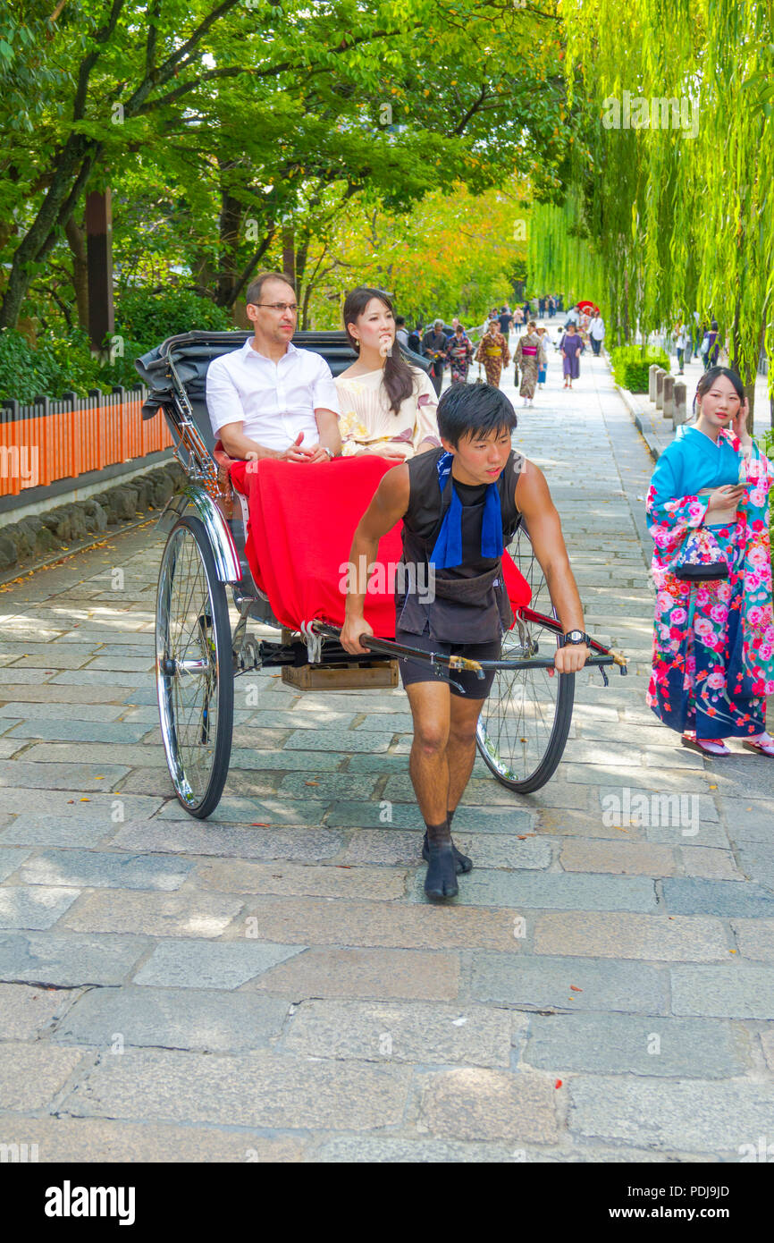 Rickshaw ride in Kyoto Japan park Stock Photo - Alamy