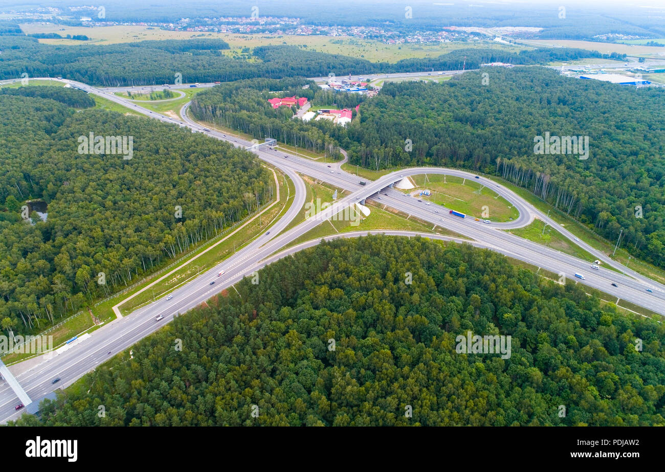 A view from above of the road, road junctions and cars. Aerial ...