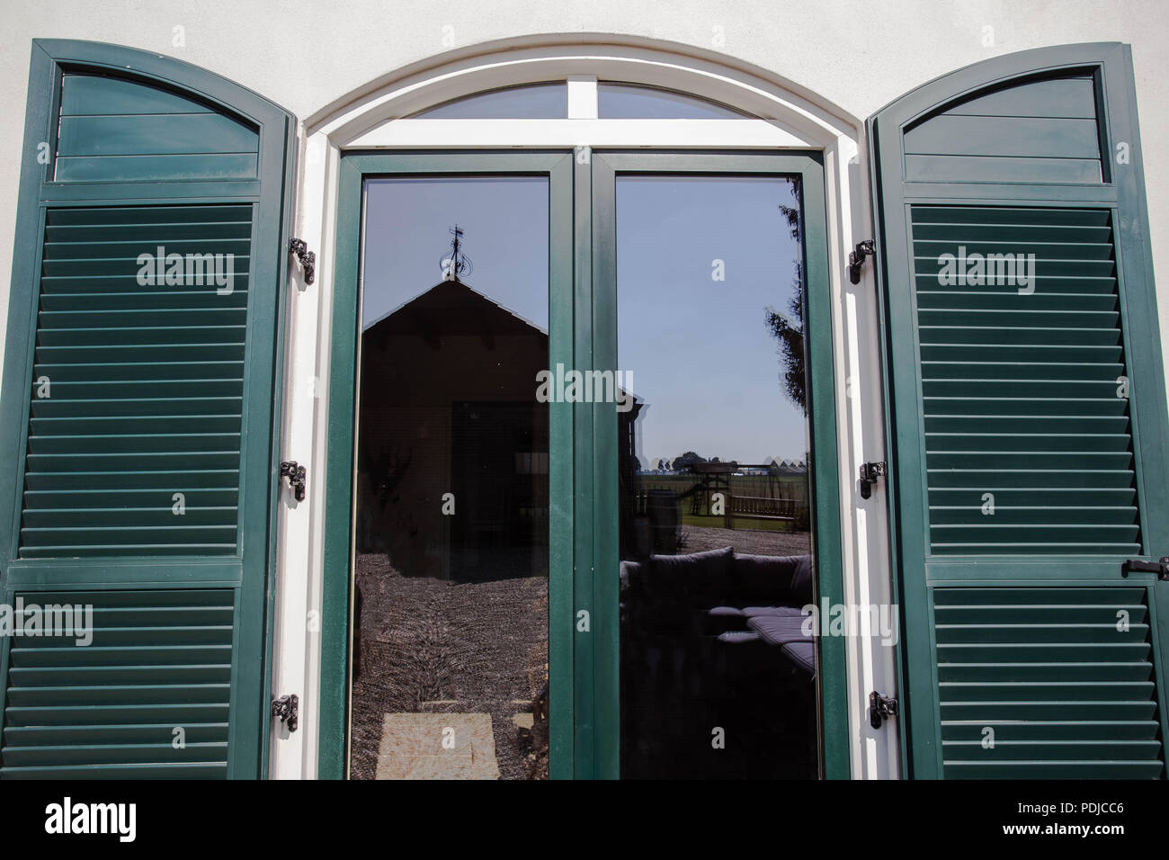Wooden window with open shutters modern design Stock Photo - Alamy