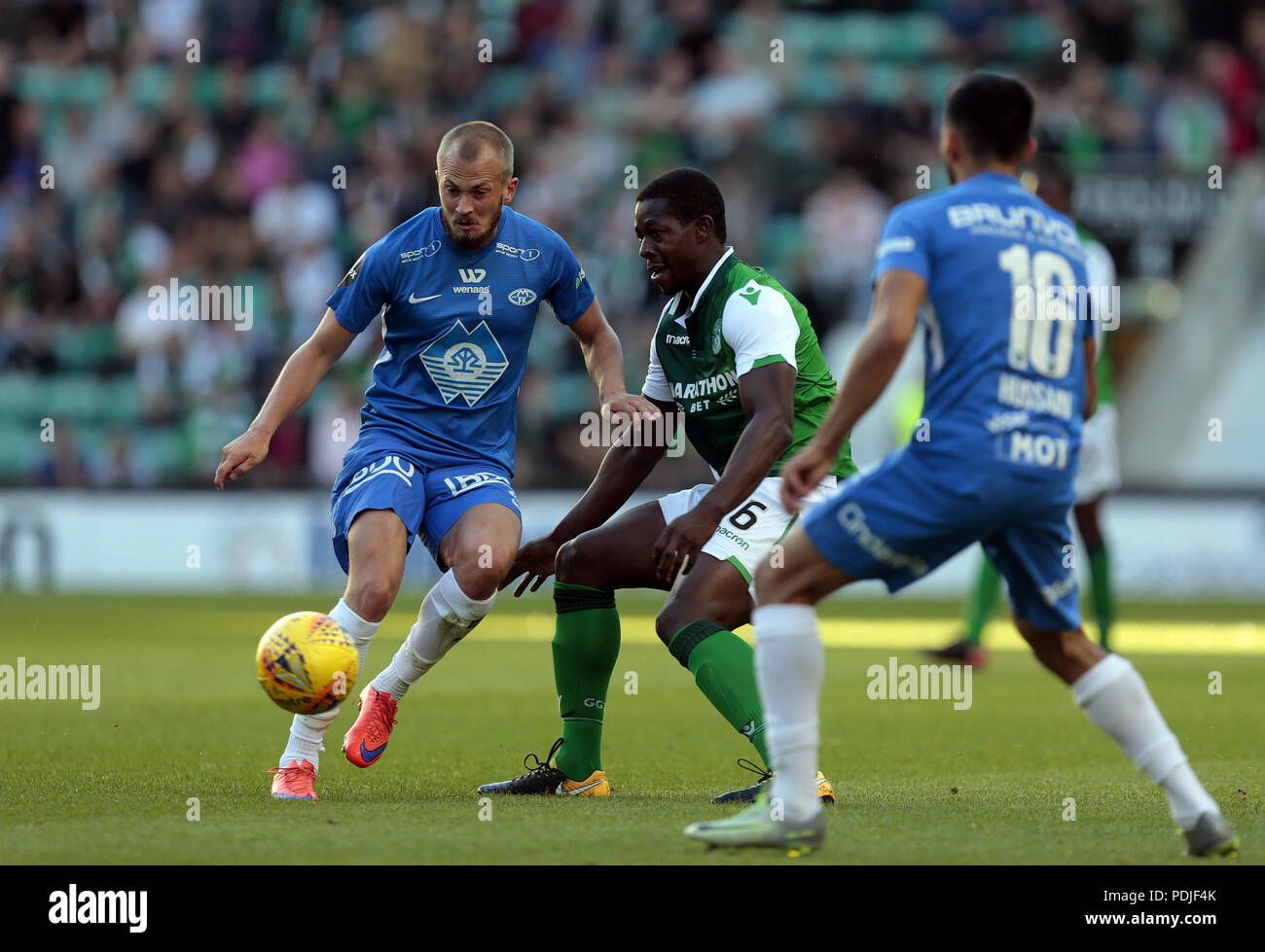 Hibernian's Marvin Bartley (right) challenges with Molde's Petter ...