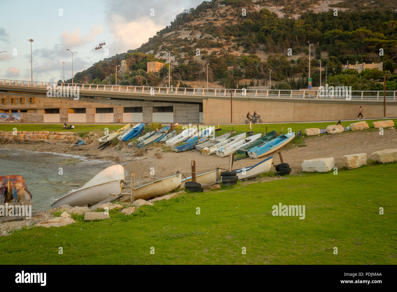 Sunset view of boats, the beach and the Allenby Interchange, in Haifa ...