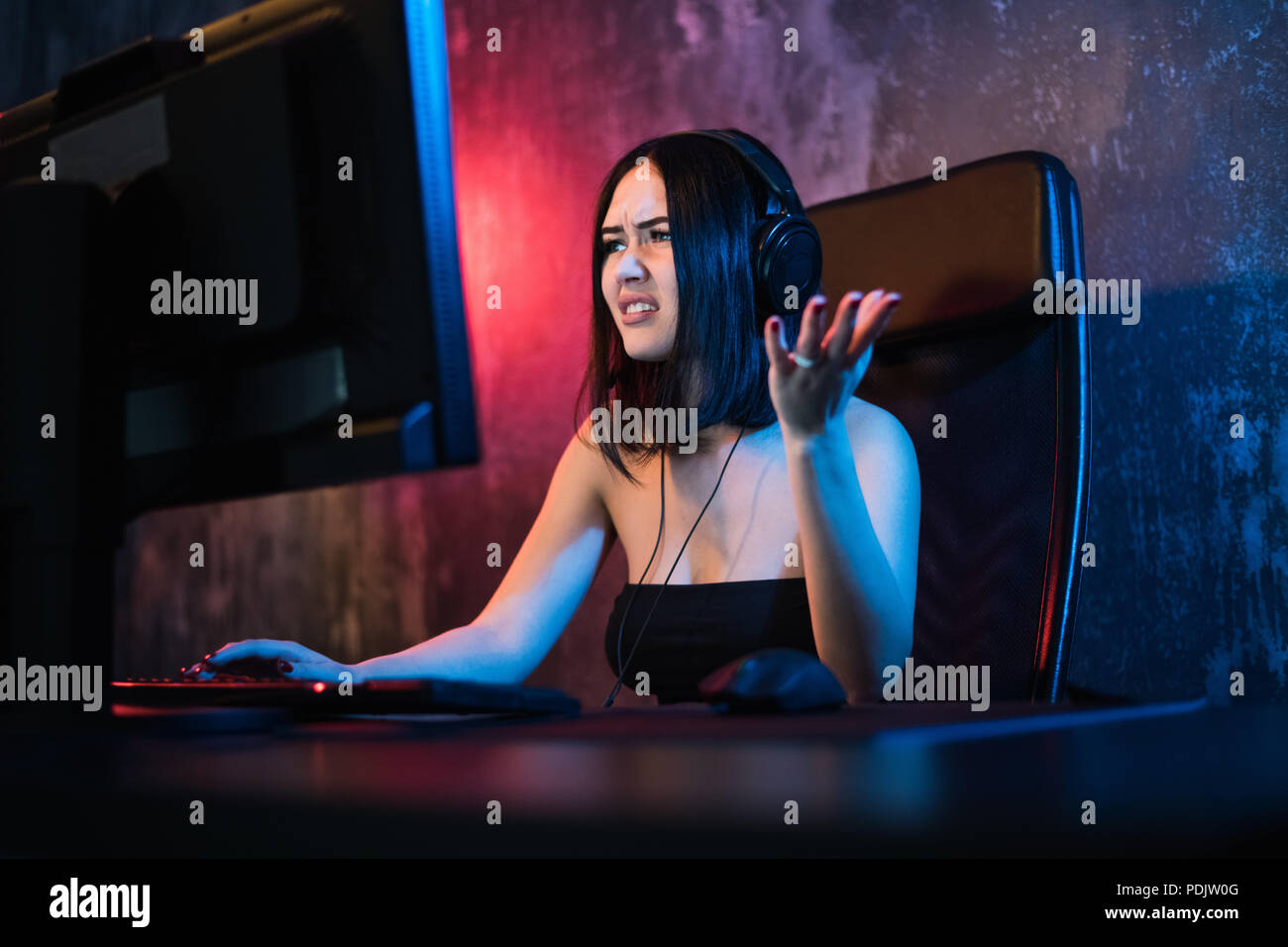 Tired female gamer playing video games hi-res stock photography and ...