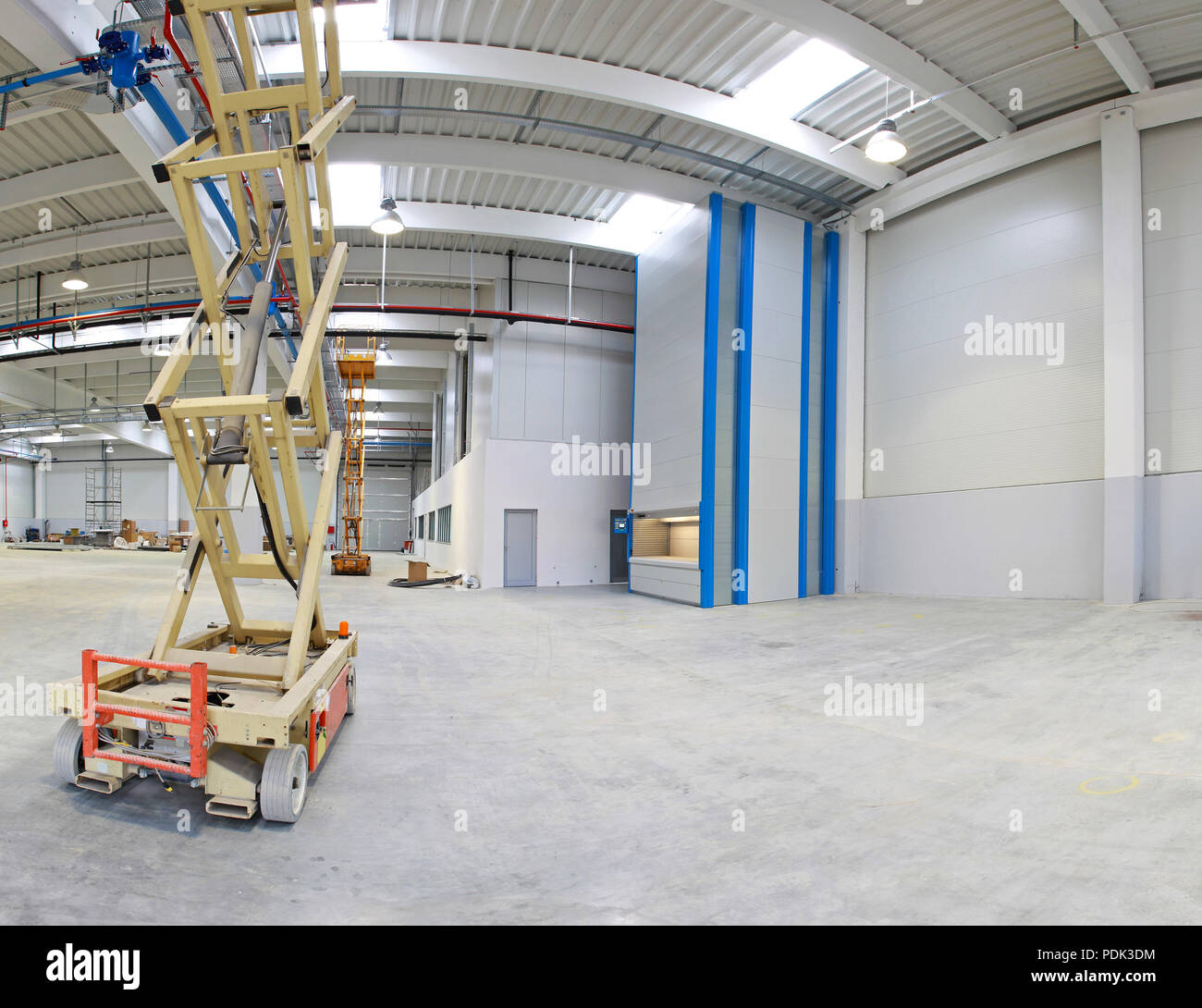 New distribution warehouse hall with hydraulic scissors lift platform ...