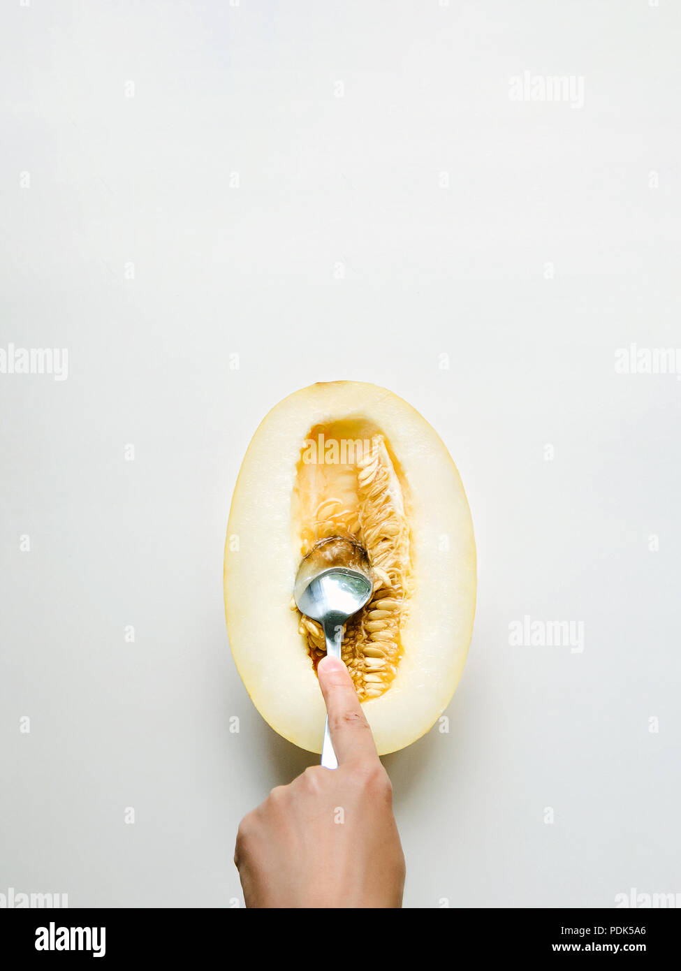 Melon Top view Half of ripe melon is lying on a white table Photo in ...