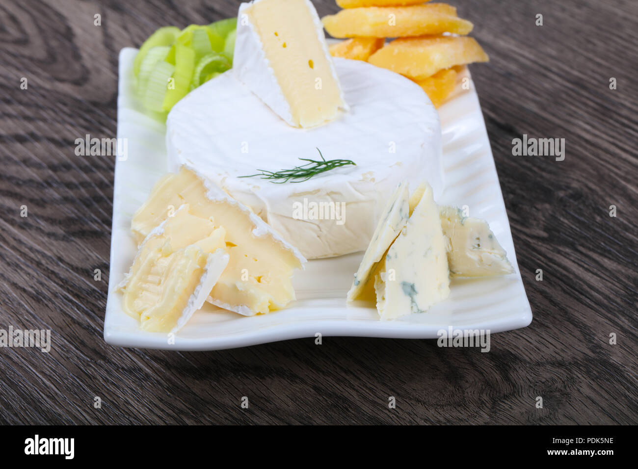 Cheese platter with brie, blue and parmesan Stock Photo - Alamy