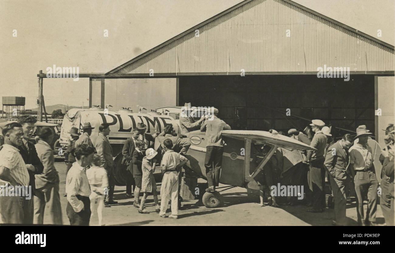 14 Arthur Butler and the Comper Swift aeroplane G-ABRE in field with ...