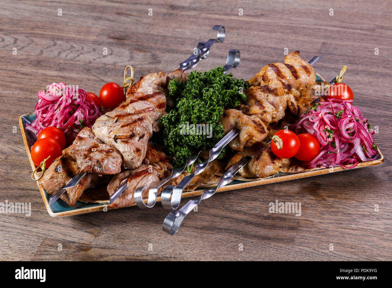 Grilled chicken and pork barbeque Stock Photo - Alamy