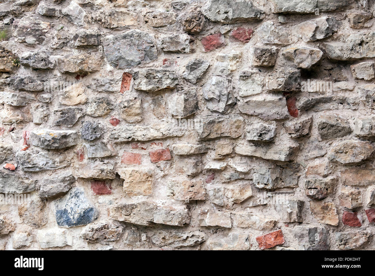 Old wall made of big stones and broken bricks. Vintage rough blocks ...