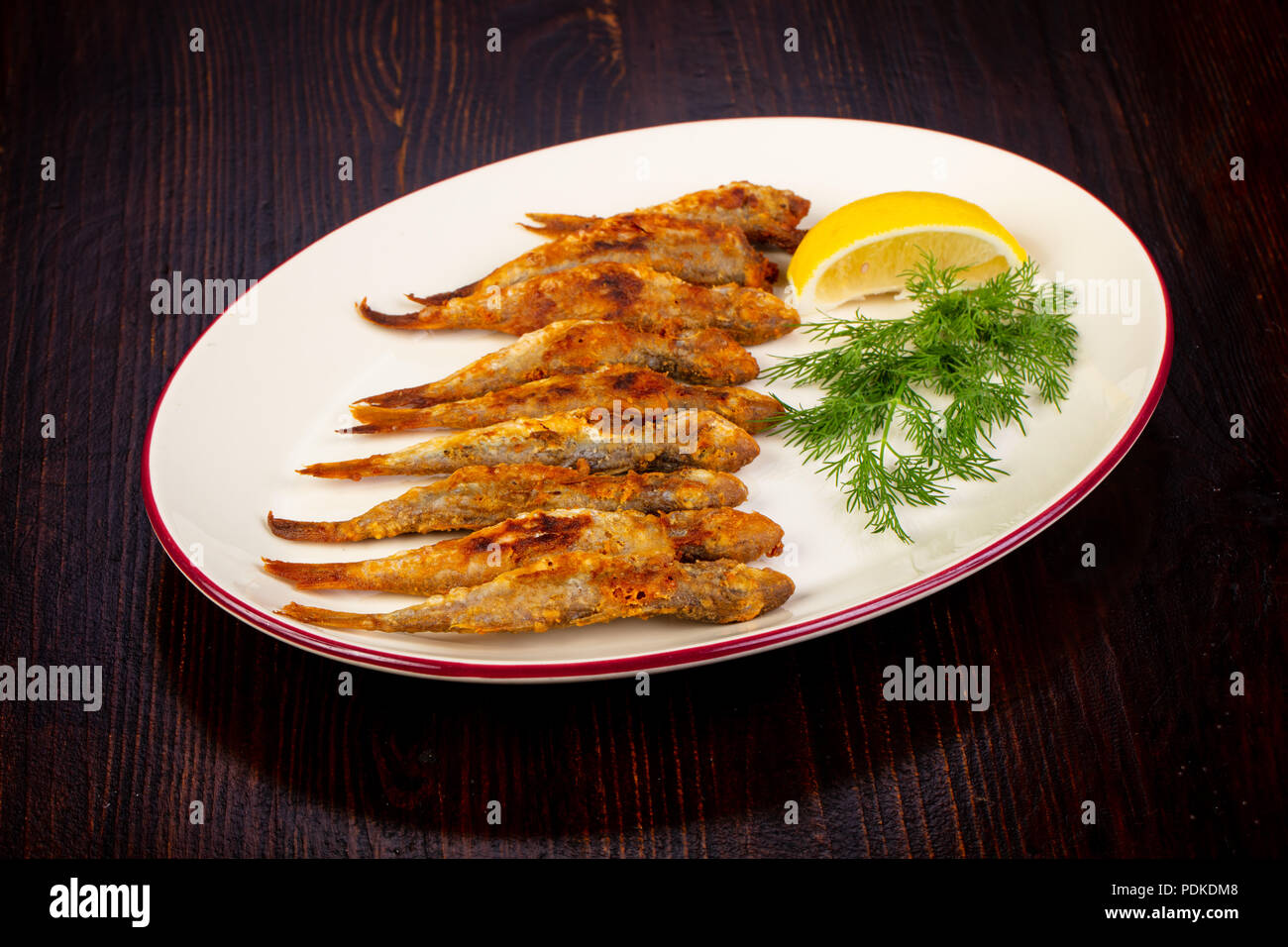 Surmullet fish with lemon and dill Stock Photo - Alamy