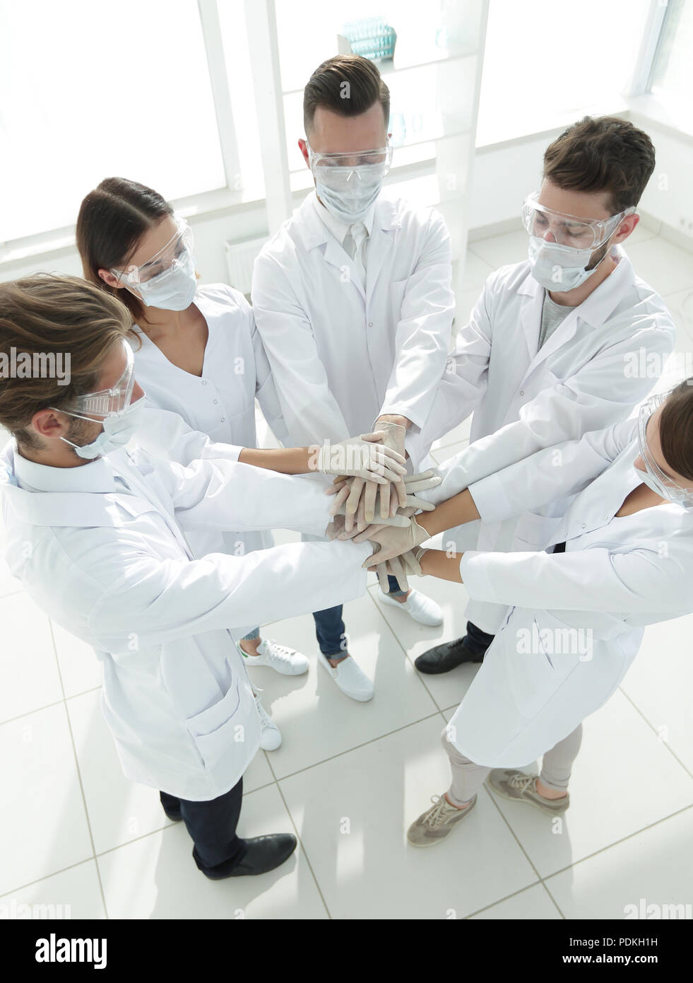 Health care workers demonstrating unity Stock Photo - Alamy