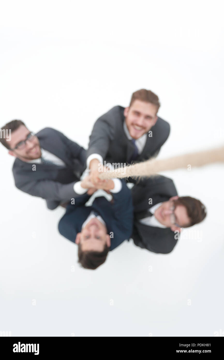 smiling business team holding the rope Stock Photo - Alamy