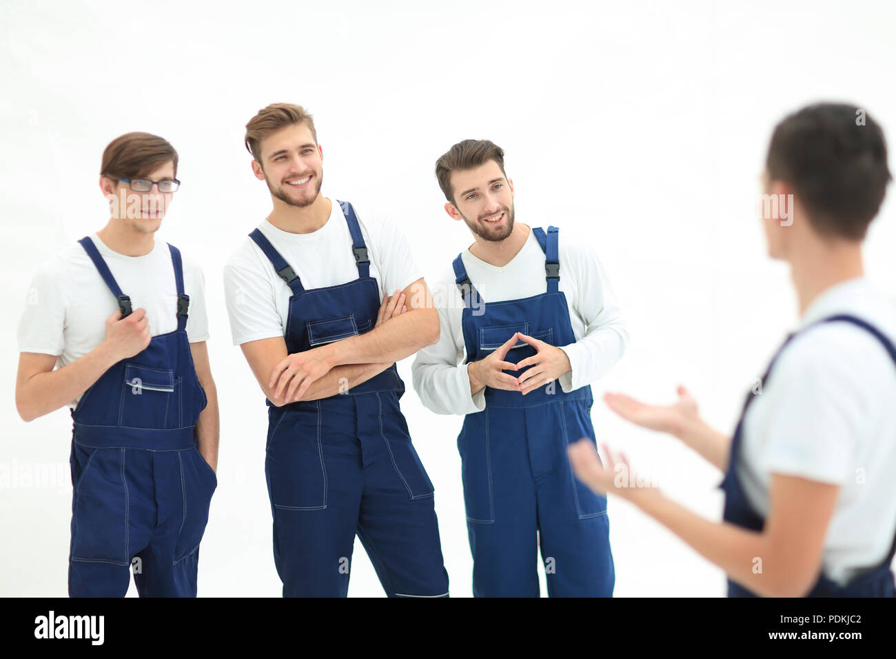 cheerful team of responsible movers and their smiling leader Stock ...