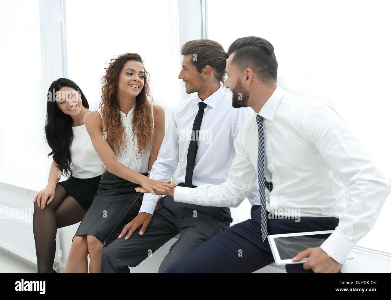 colleagues giving each other high five Stock Photo - Alamy