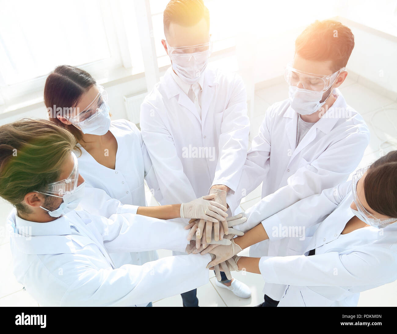 Health care workers demonstrating unity Stock Photo - Alamy