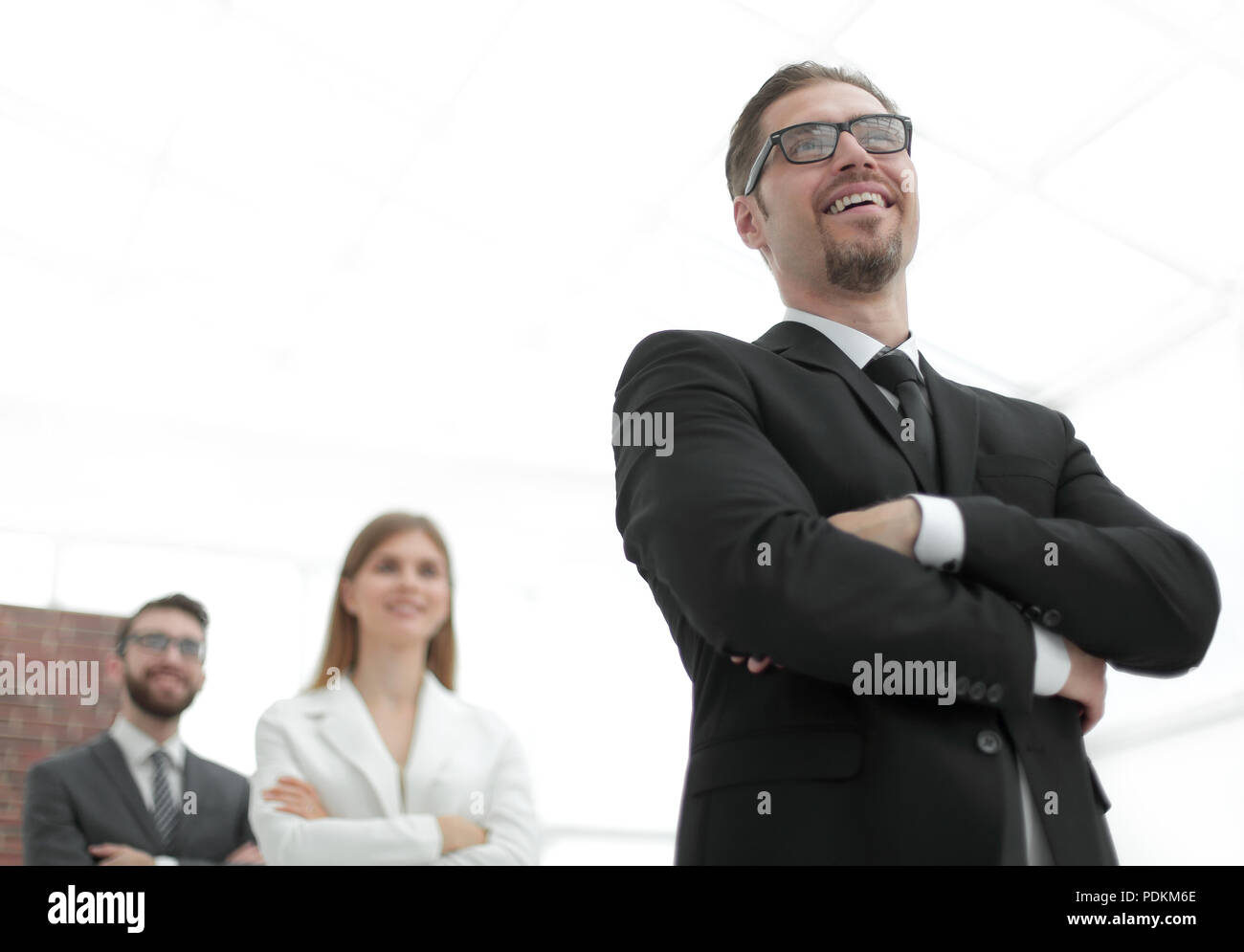project Manager standing in front of his business team Stock Photo - Alamy