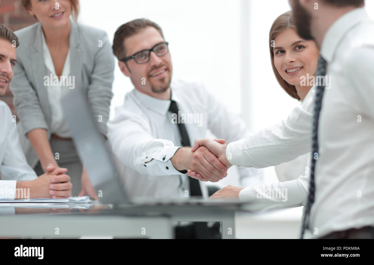 Manager shaking the hand of the customer Stock Photo - Alamy