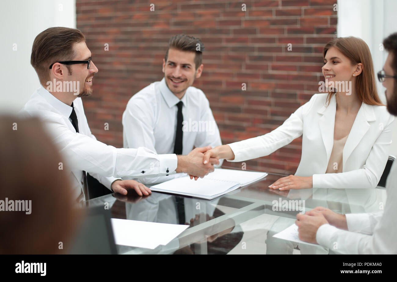 smiling Manager shaking hands with customer Stock Photo - Alamy