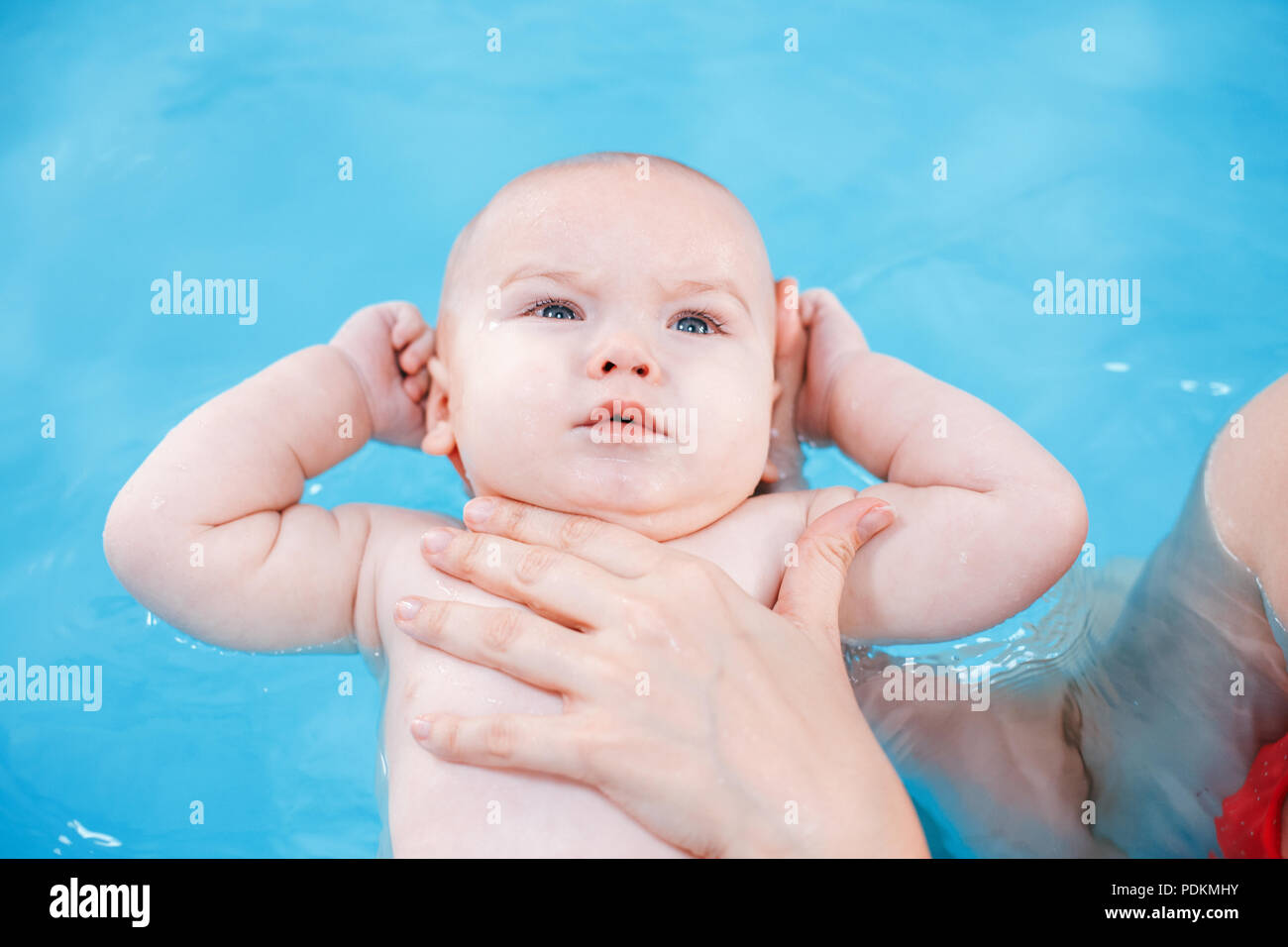 Baby in float hi-res stock photography and images - Alamy