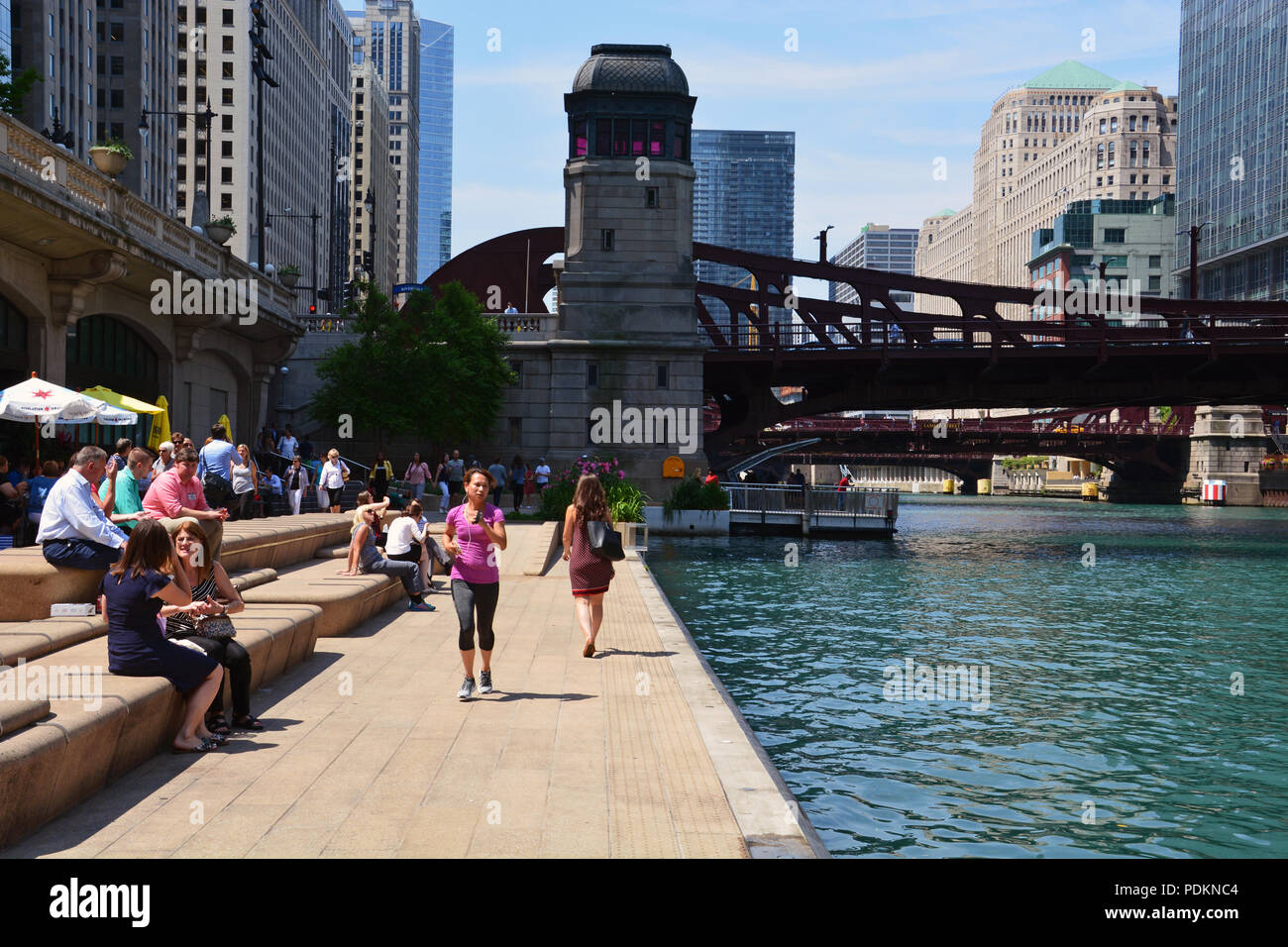 A section of the Chicago Riverwalk known as the Cove includes seating ...