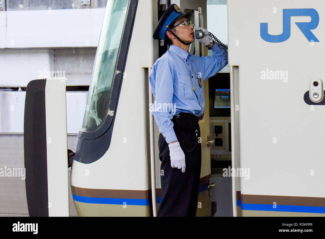 Train conductor, Japan Stock Photo - Alamy