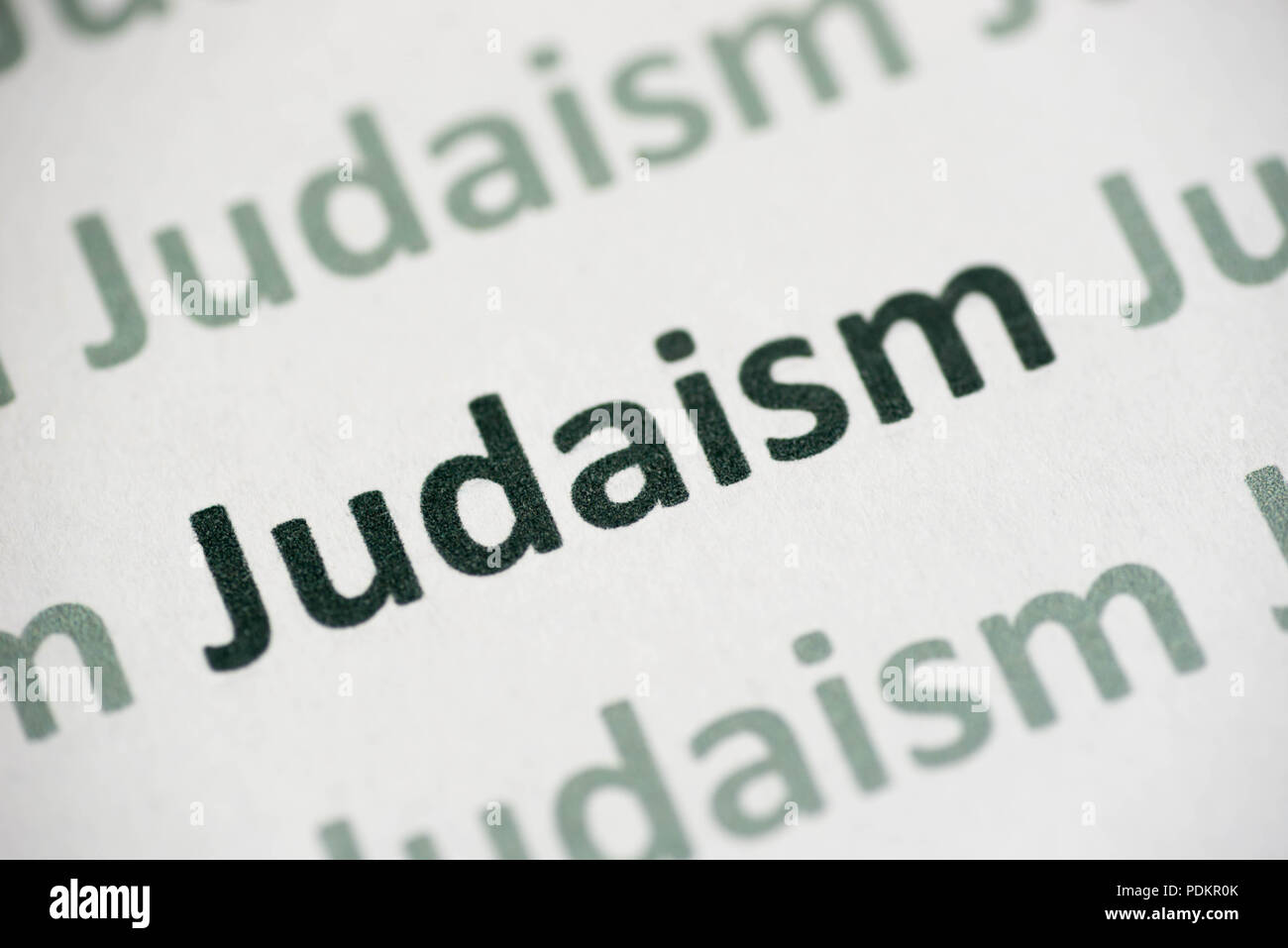 word Judaism printed on white paper macro Stock Photo - Alamy