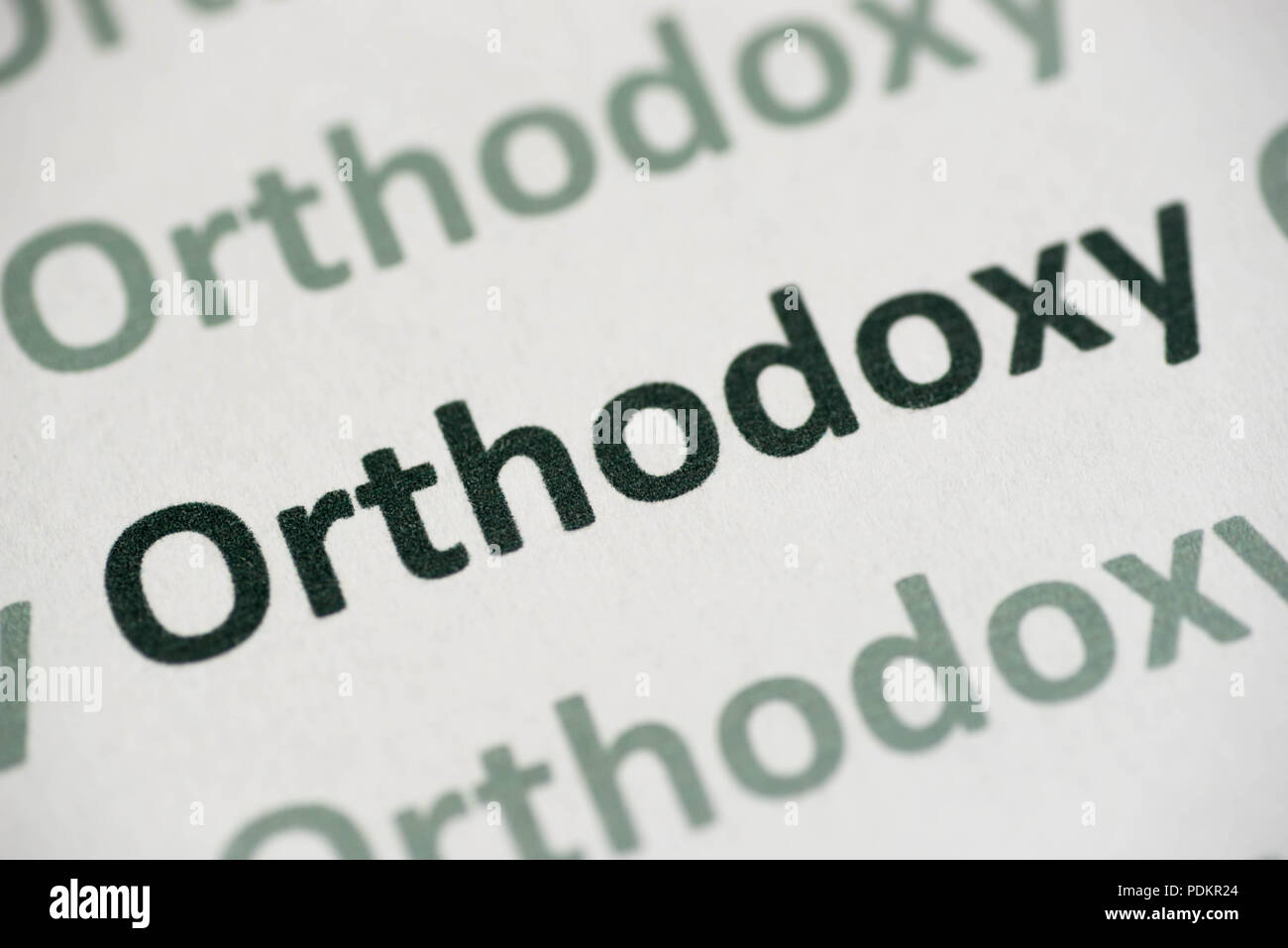 word Orthodoxy printed on white paper macro Stock Photo - Alamy