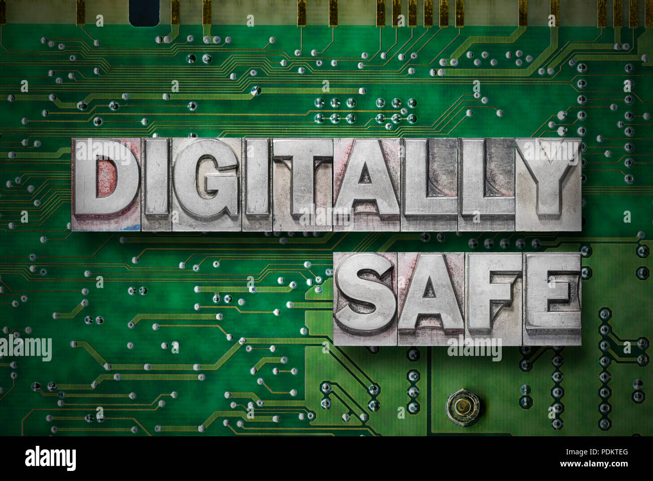 digitally safe phrase made from metallic letterpress blocks on the pc ...